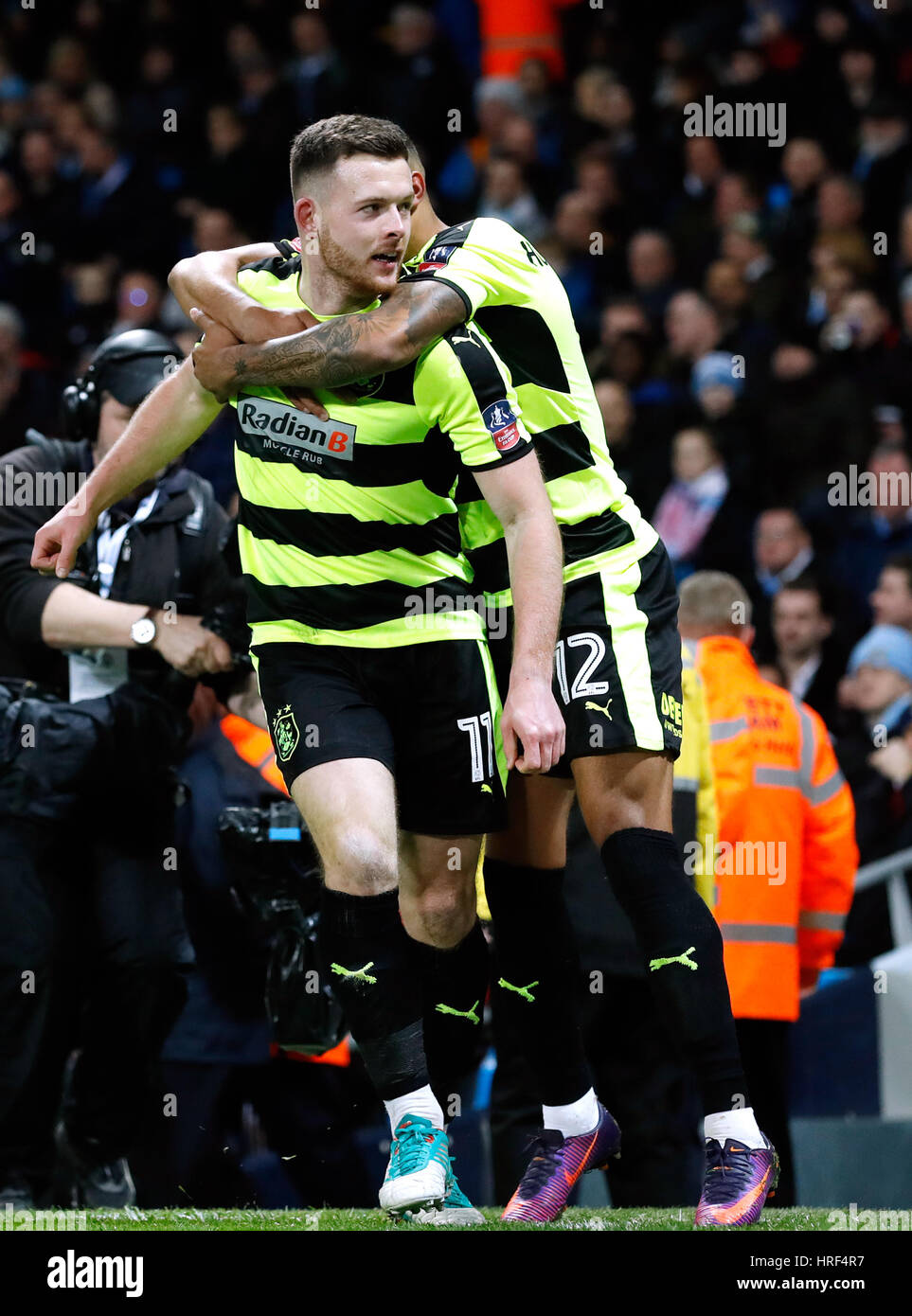 Huddersfield Town's Harry Bunn (left) celebrates scoring his side's ...