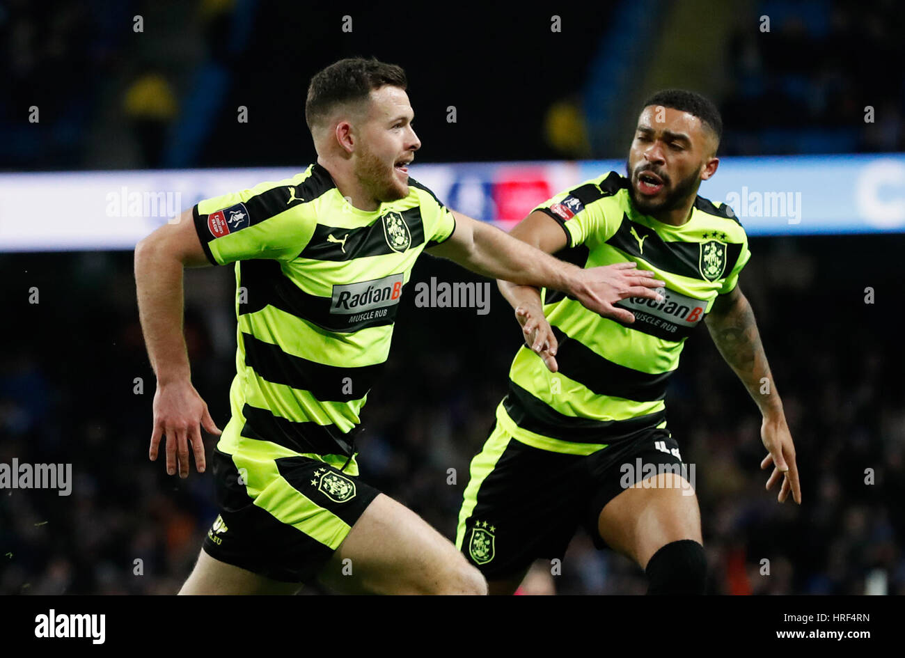 Huddersfield Town's Harry Bunn (left) celebrates scoring his side's ...