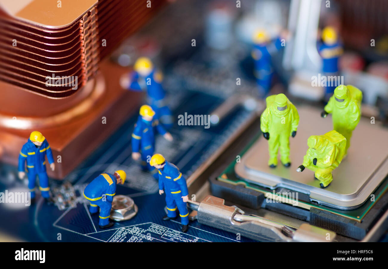 Group of construction workers repairing motherboard Stock Photo - Alamy