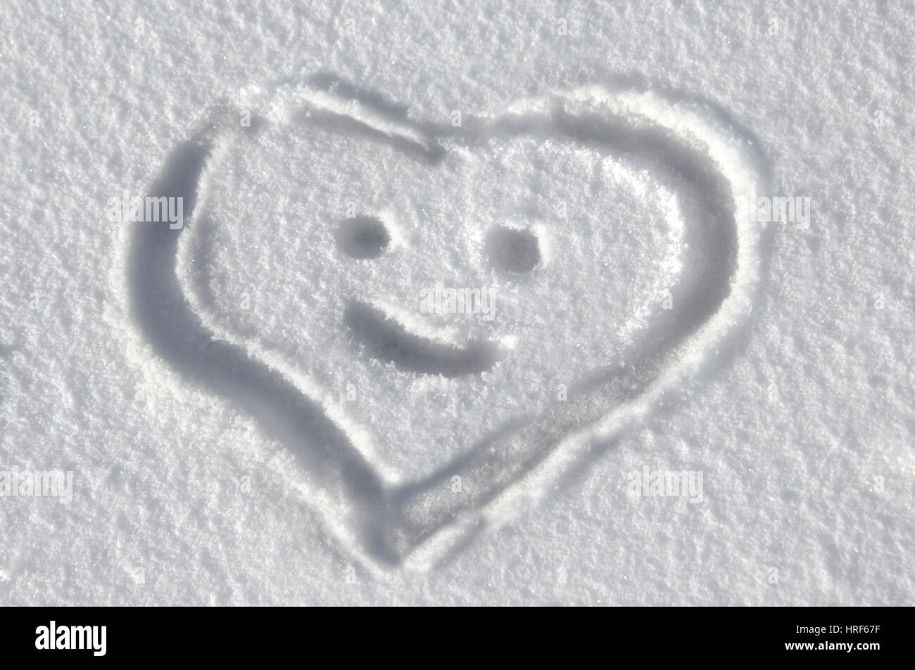 Drawing of a smiling heart lays on a fresh layer of snow in Colorado ...