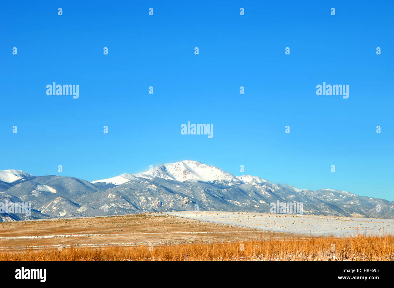 Blue, morning skies frame Pike's Peak in the Colorado Rocky Mountains ...