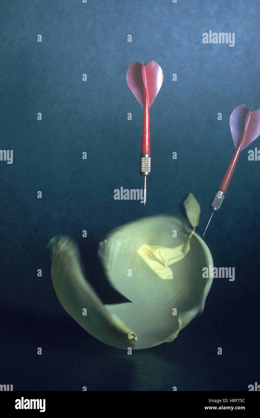 Dart Breaking Balloon Stock Photo - Alamy