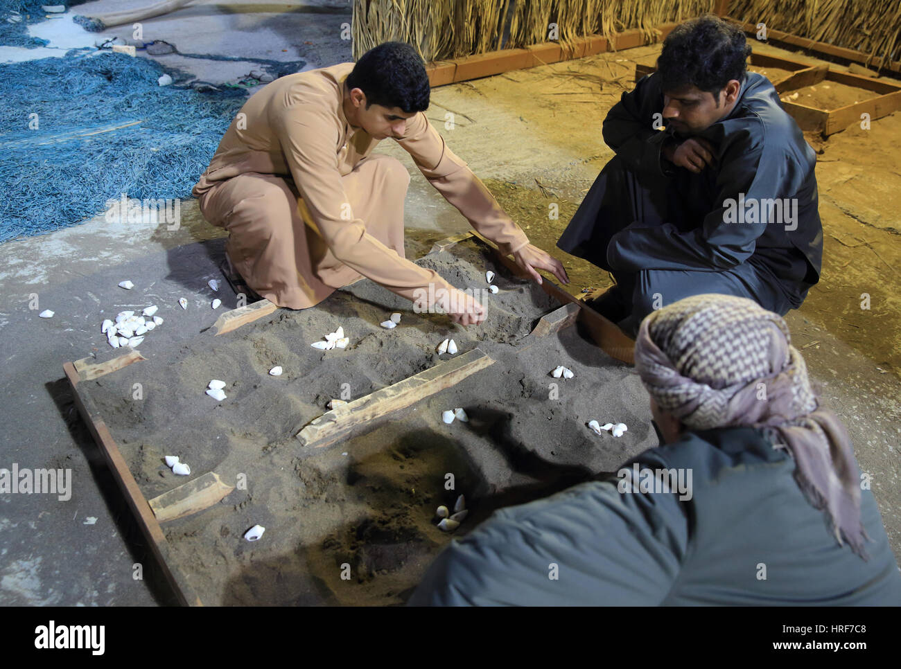 Participants playing a shell game at the Heritage Village, at the ...