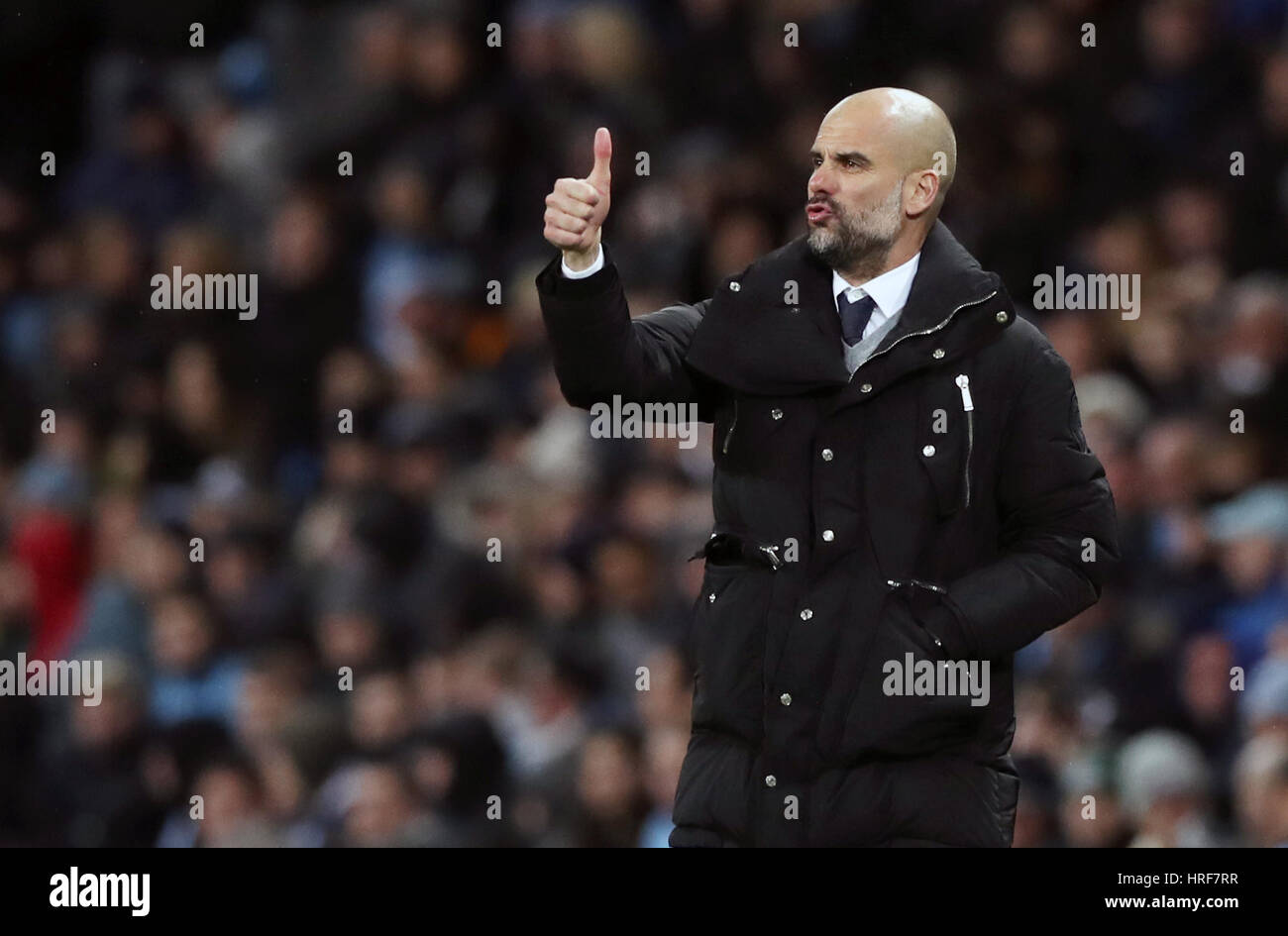 Manchester city manager pep guardiola gestures on the touchline during ...