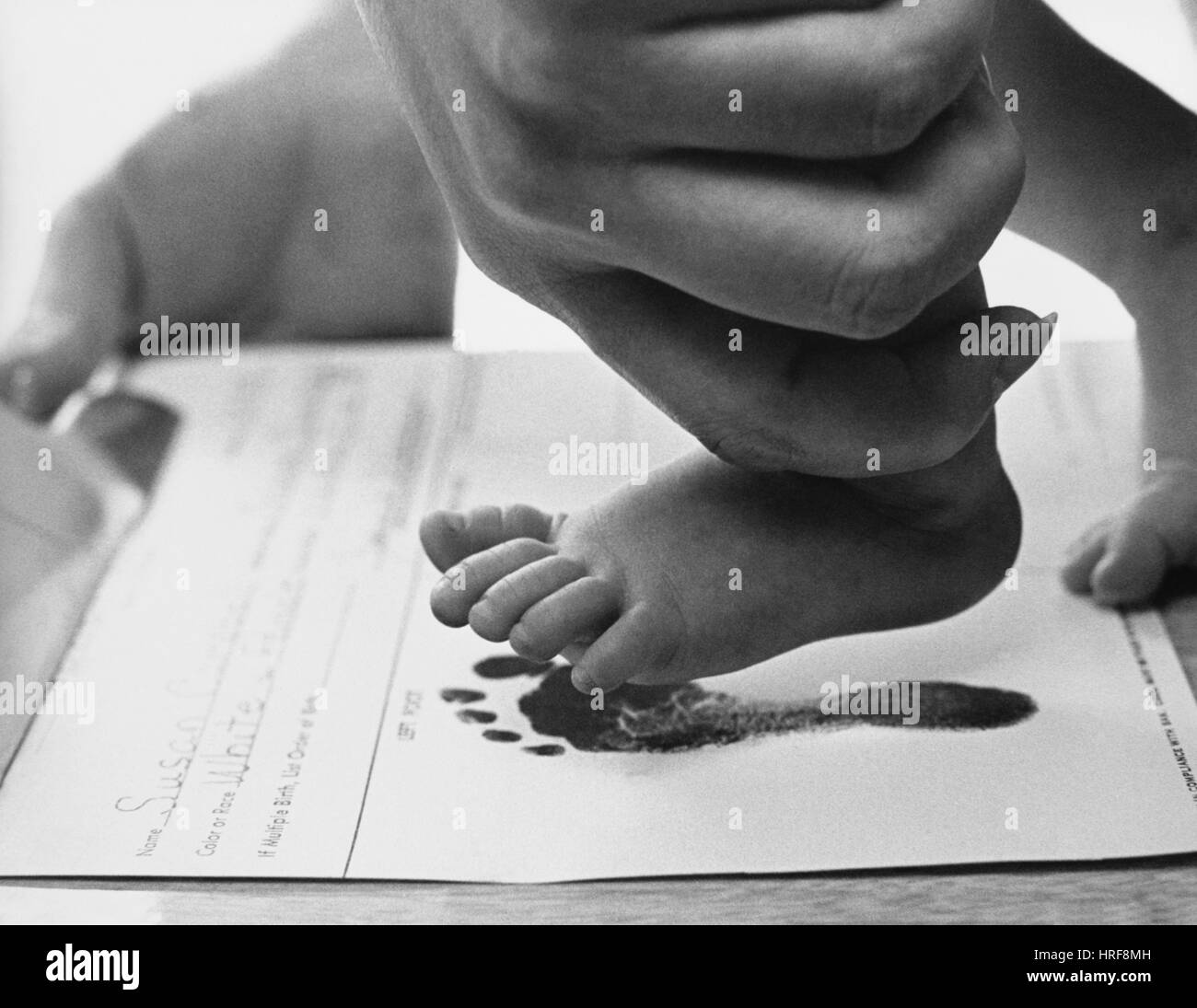 Baby footprint Black and White Stock Photos & Images - Alamy