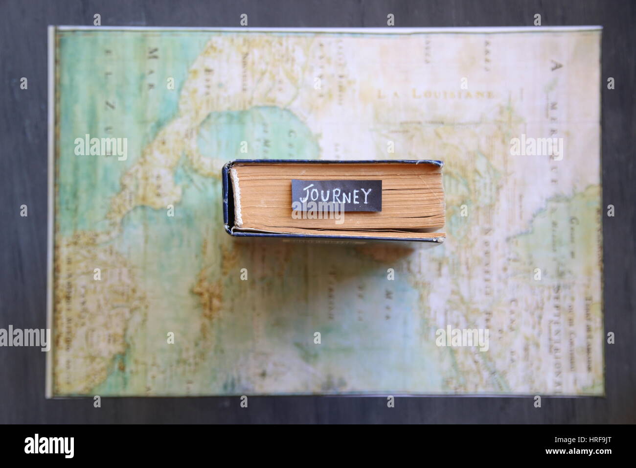 Journey - label on the old wooden vintage table Stock Photo - Alamy