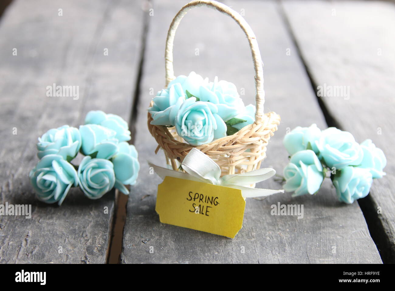 Bouquet of spring flowers in basket spring sale Stock Photo - Alamy