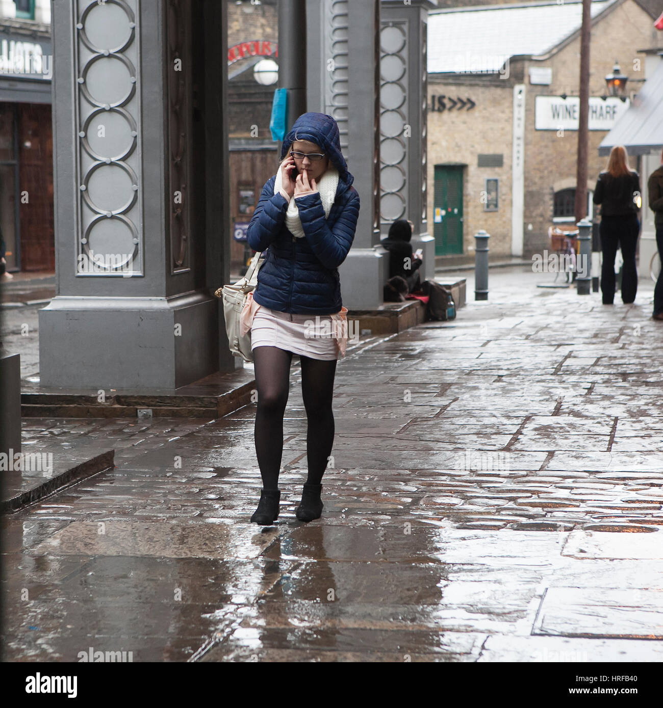 Boy hiding from rain hi-res stock photography and images - Alamy