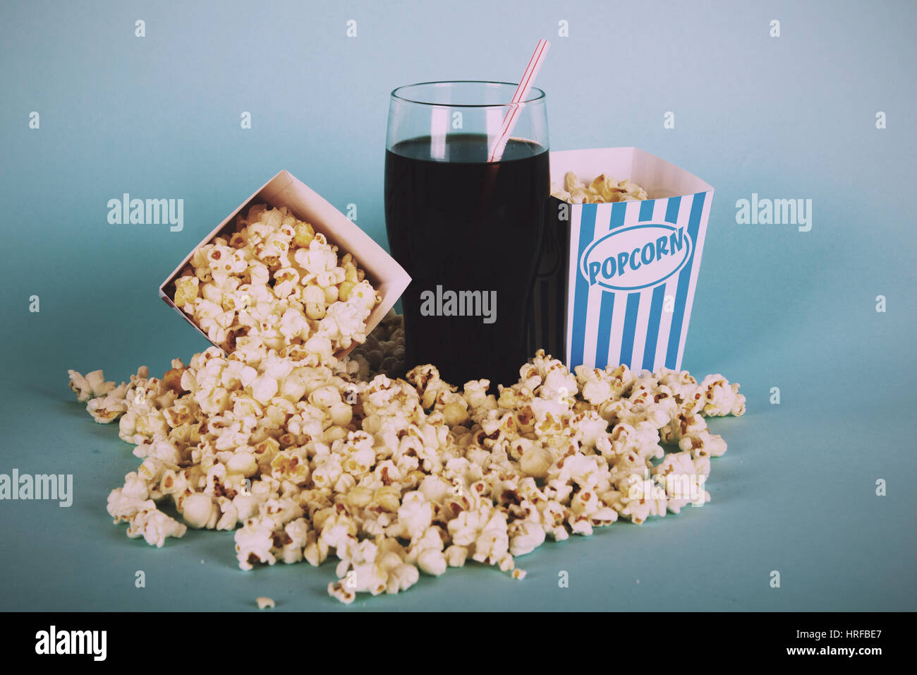 Bucket of popcorn against a blue background Vintage Retro Filter Stock ...
