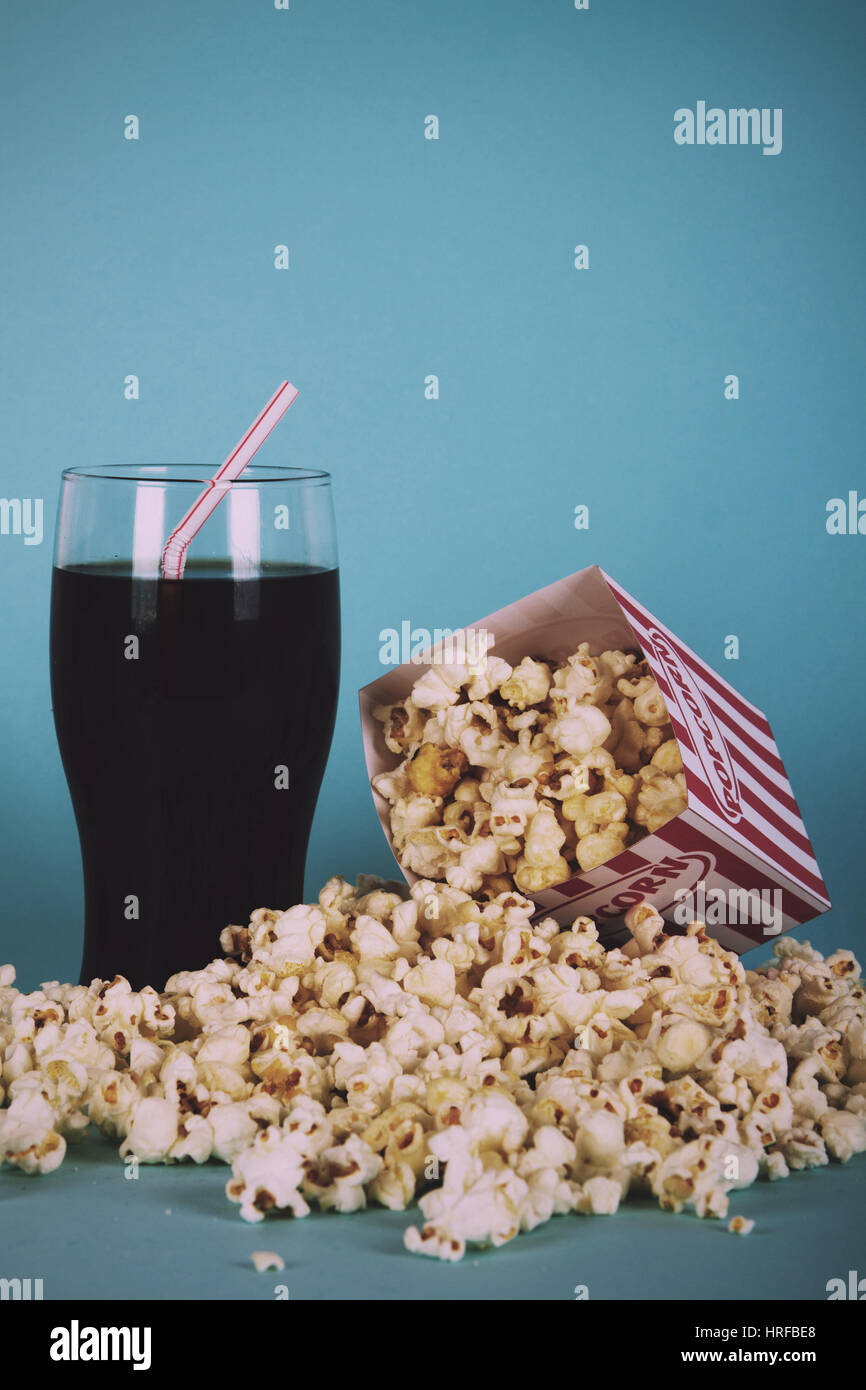 Bucket of popcorn against a blue background Vintage Retro Filter Stock ...