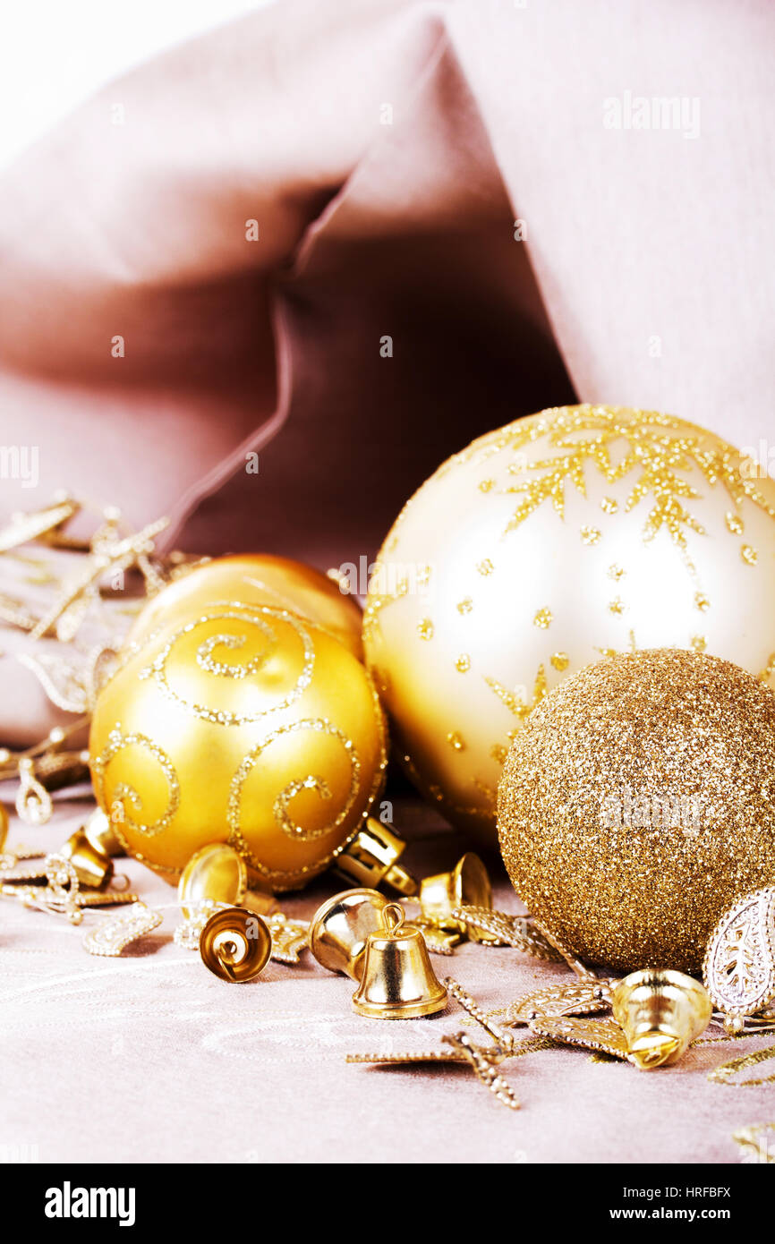 Festive gold Christmas decorations on a fabric background Stock Photo ...