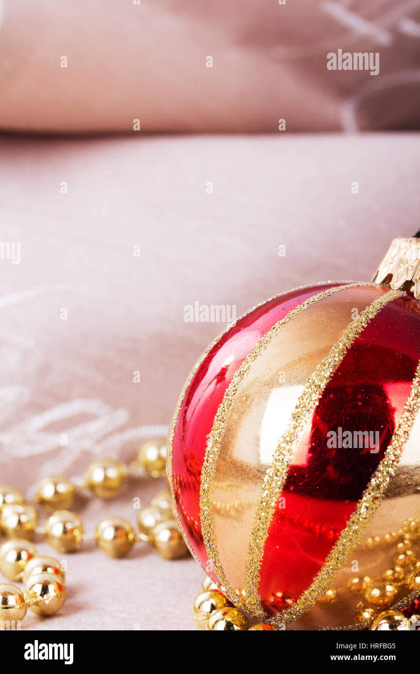 Festive gold Christmas decorations on a fabric background Stock Photo ...