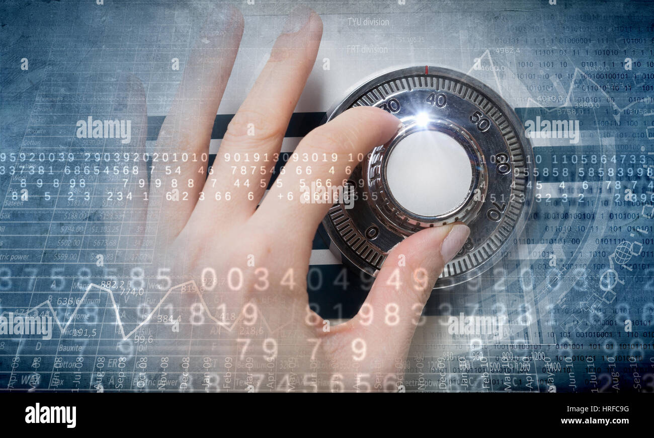 Hands of businesswoman dialing code on safe lock Stock Photo - Alamy