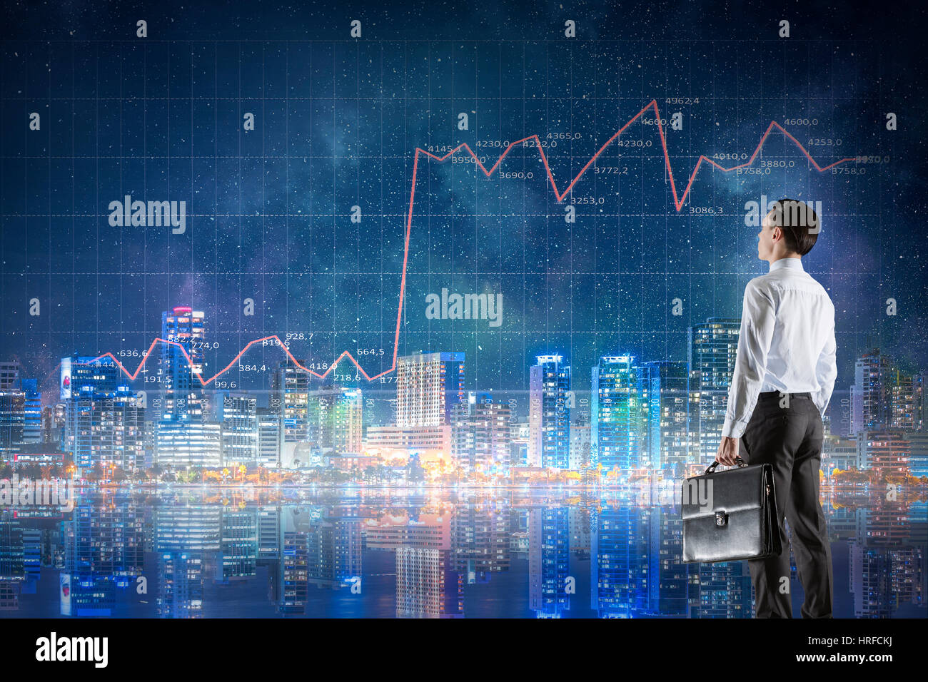 Businessman with briefcase looking at business charts and graphs on ...