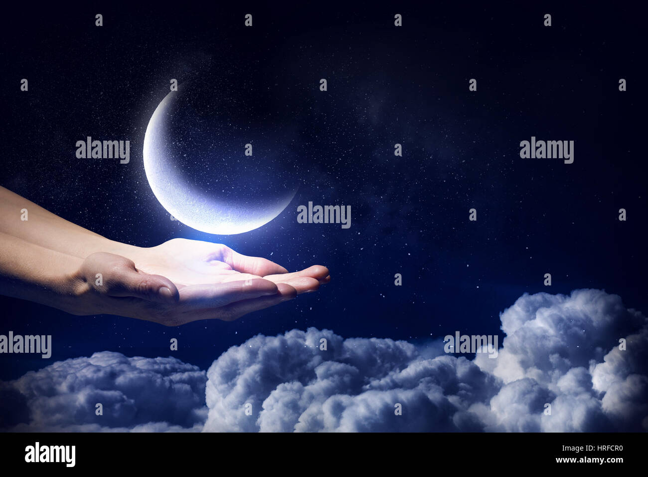 Human hand holding moon planet in palm Stock Photo - Alamy