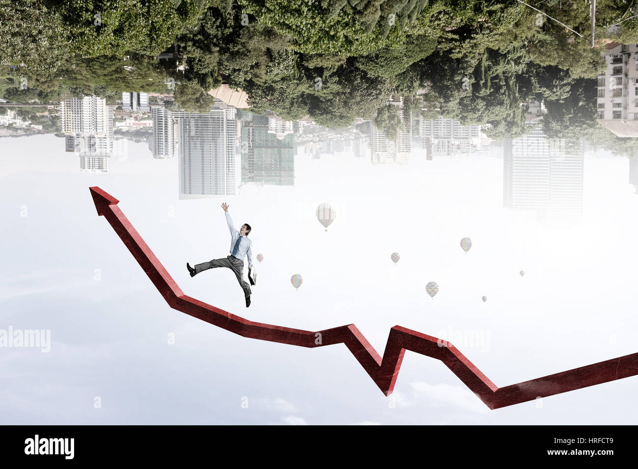 Cheerful businessman jumping up on red growing arrow Stock Photo - Alamy