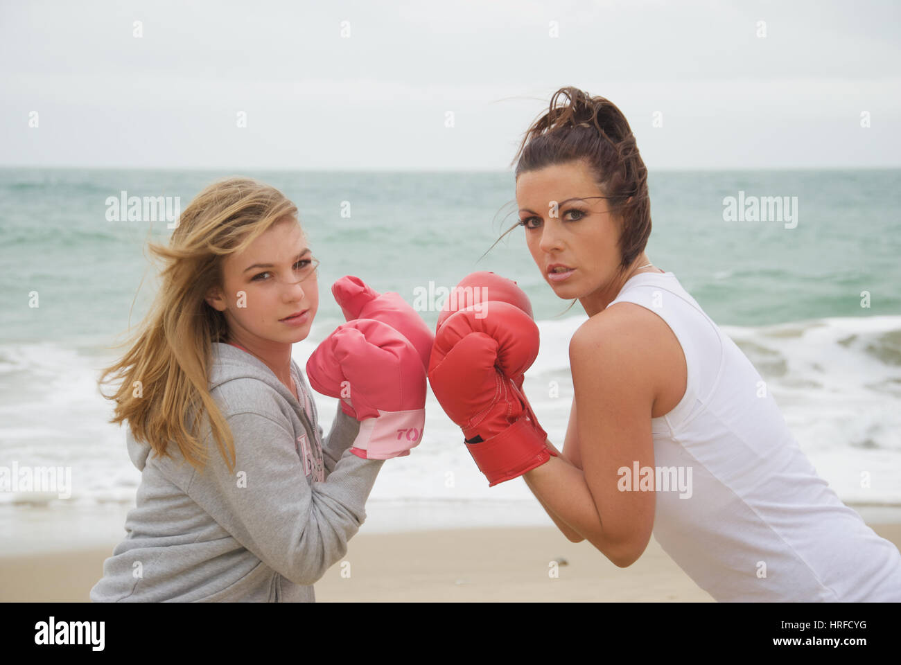 Two sisters boxing on the beach Stock Photo - Alamy