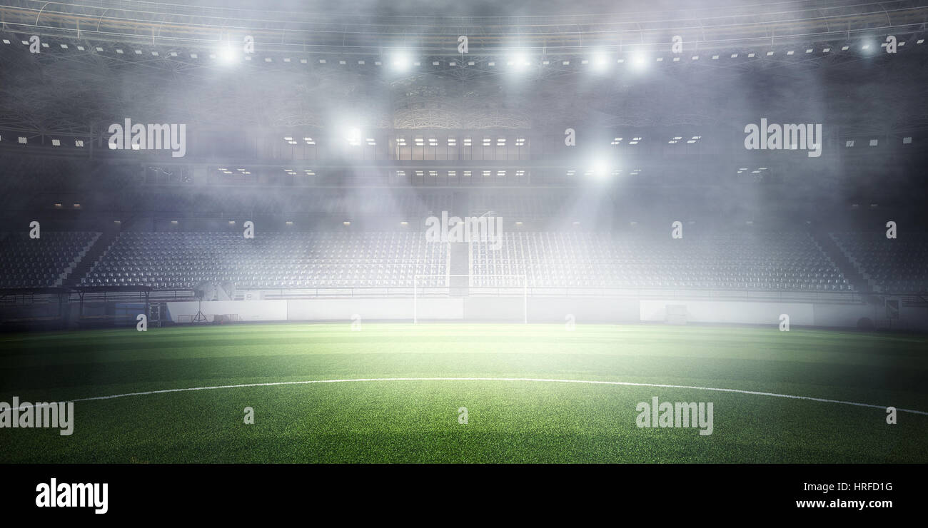 Empty football stadium in fog and spotlights. Mixed media Stock Photo ...