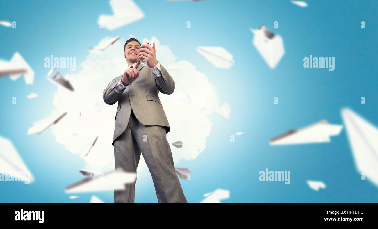 Giant businessman with long legs standing on road Stock Photo - Alamy