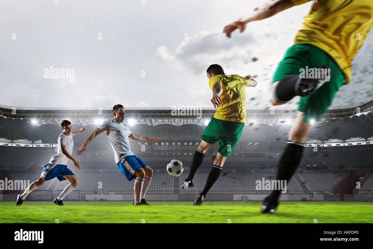 Soccer players in action on stadium fighting for ball. Mixed media ...