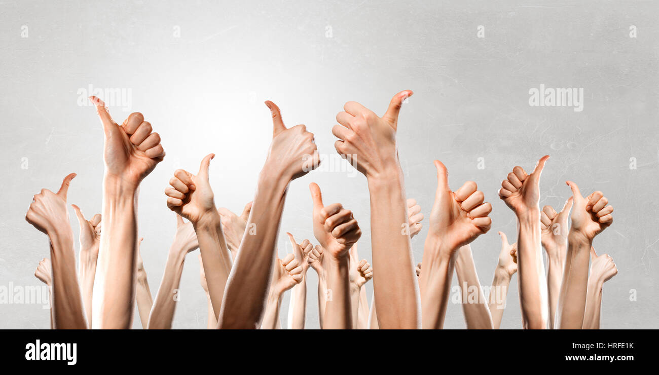 Row of raised hands showing different gestures Stock Photo - Alamy