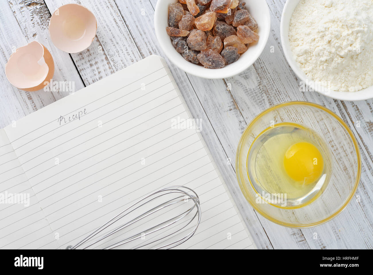 Note book and ingredients for baking on a wooden background Stock Photo ...