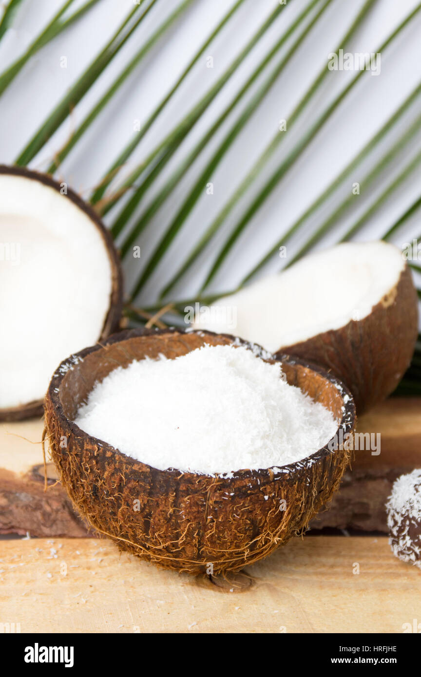 Coconut powder in a natural shell with leaves Stock Photo - Alamy