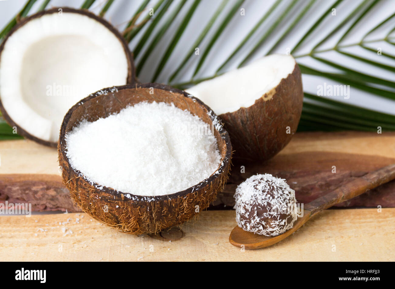 Coconut powder in a natural shell with leaves Stock Photo - Alamy