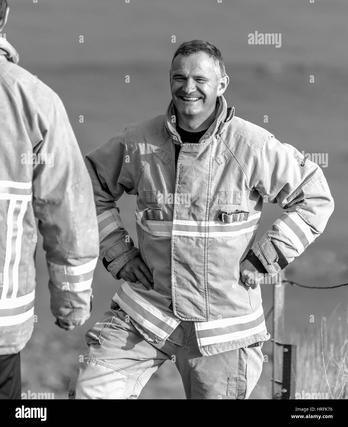 Fire officer smiling at conclusion of incident Stock Photo - Alamy