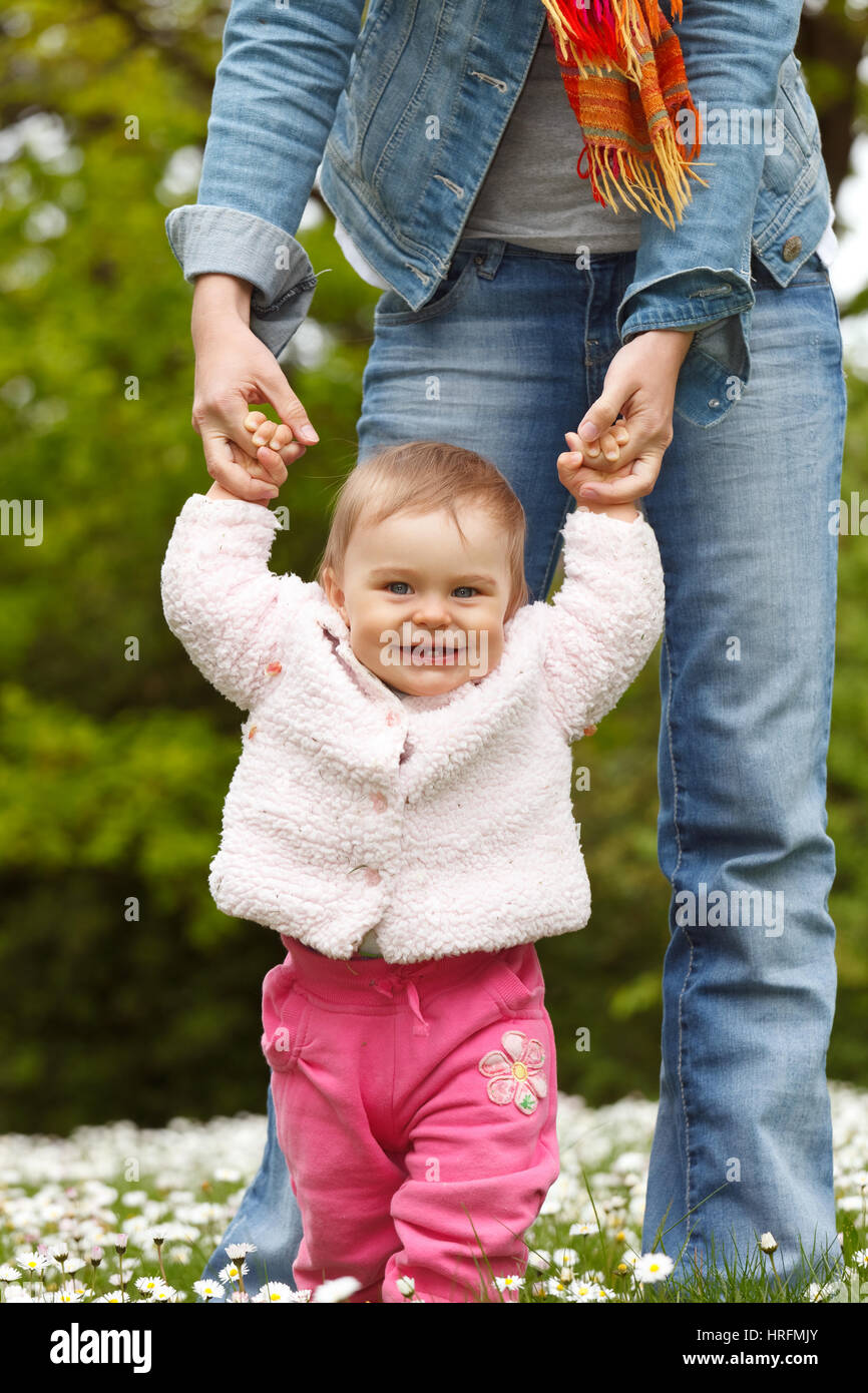 Baby's first steps Stock Photo - Alamy
