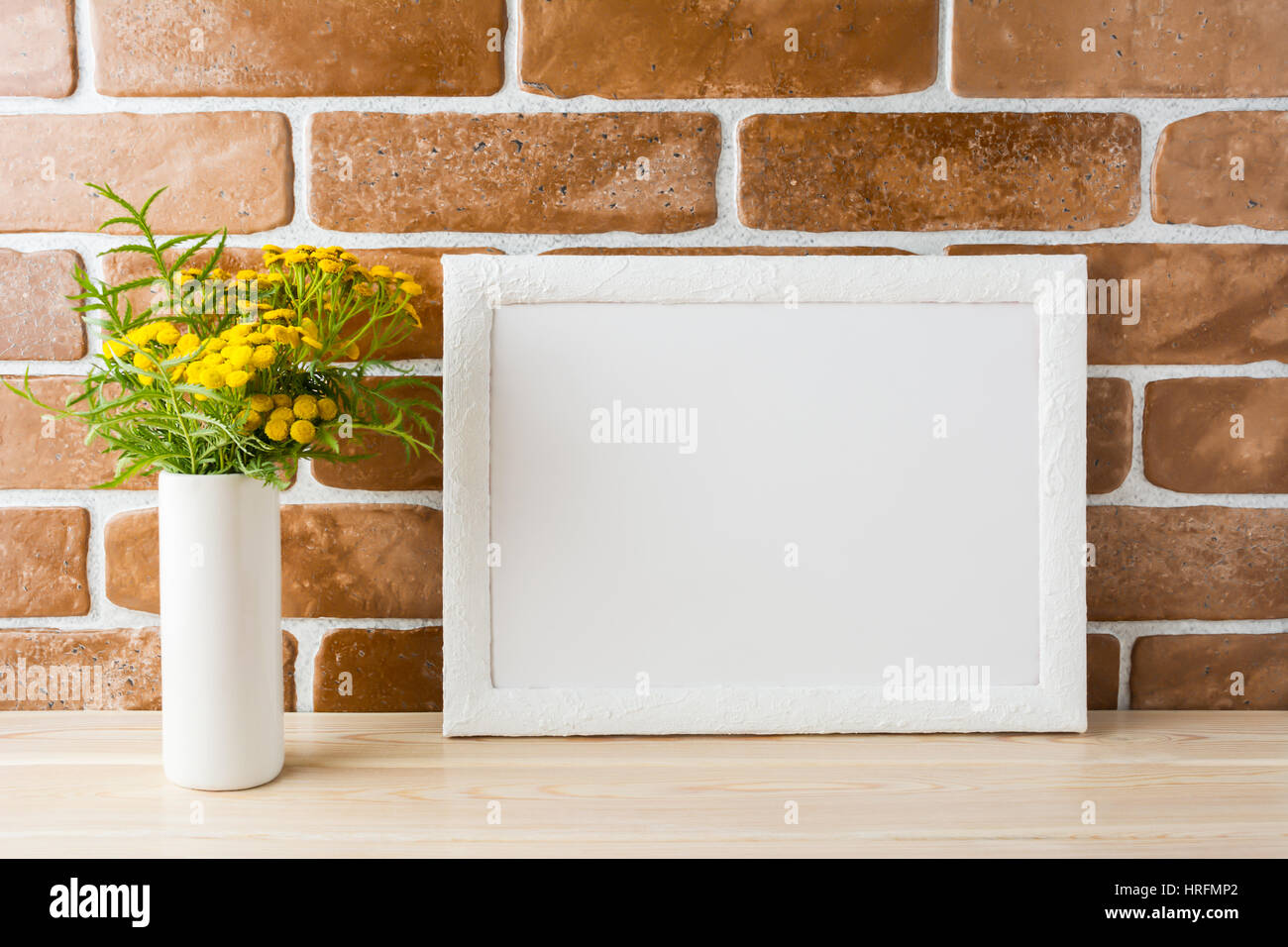 White landscape frame mockup with wild rich golden yellow flowers in ...