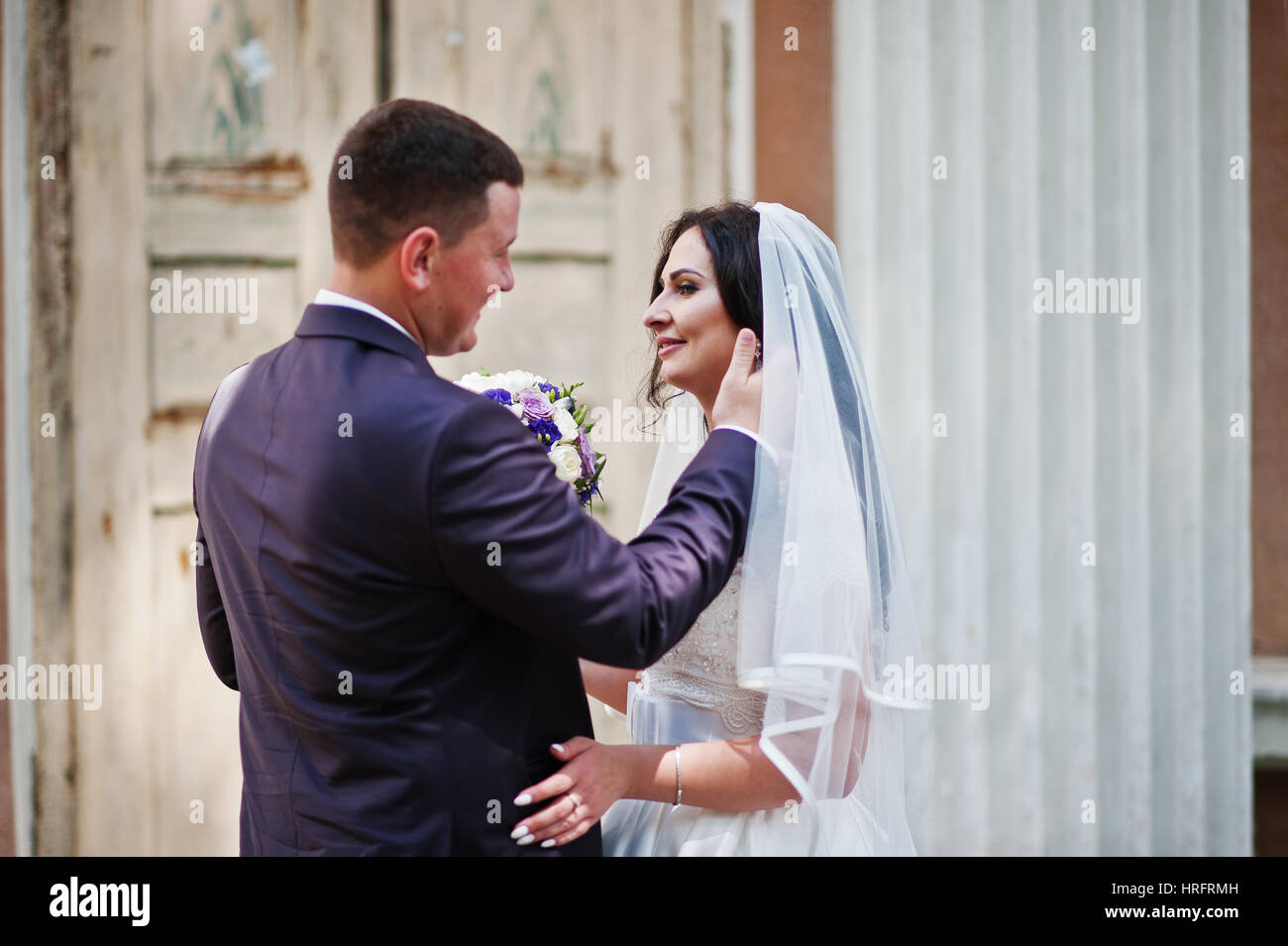 Solid wedding couple background old building with columns Stock Photo ...