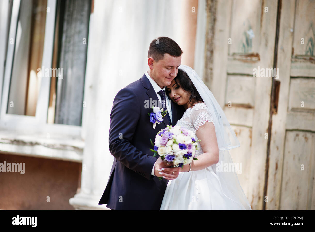 Solid wedding couple background old building with columns Stock Photo ...