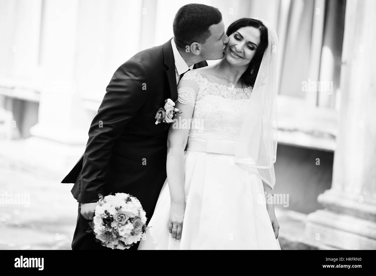 Solid wedding couple background old building with columns. Black and ...