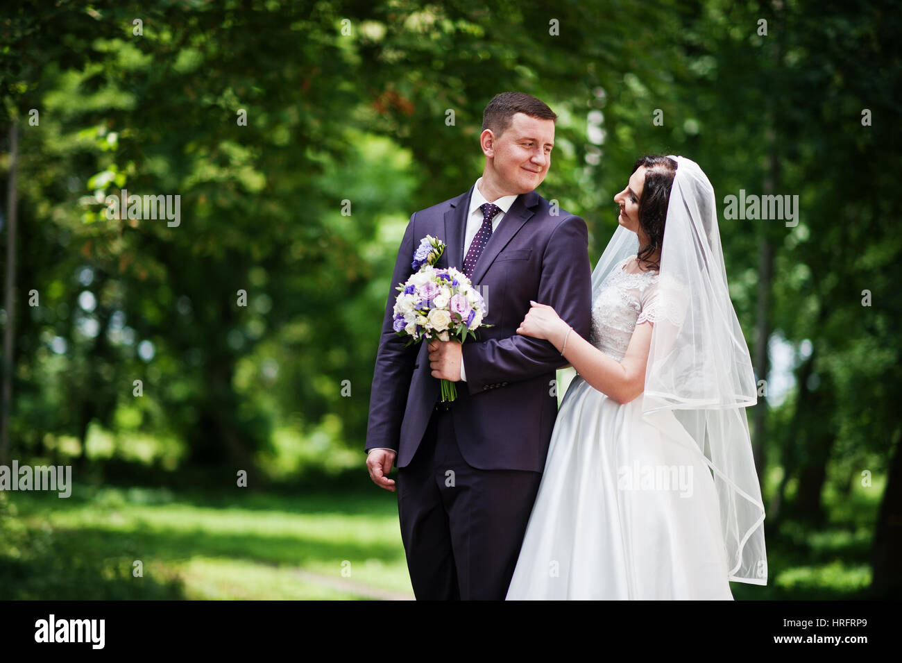 Magnificent wedding couple background green park in love Stock Photo ...