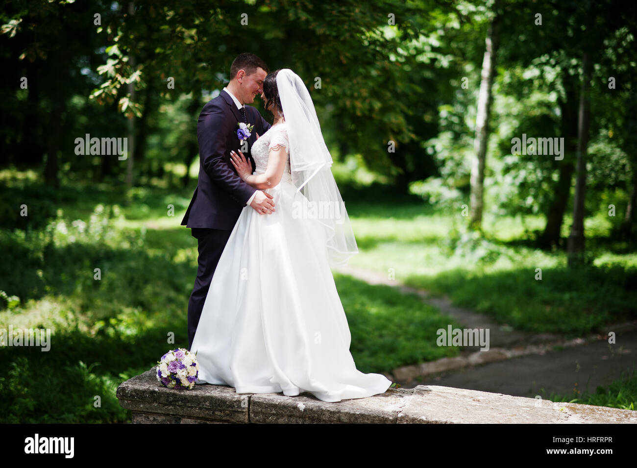 Magnificent wedding couple background green park in love Stock Photo ...