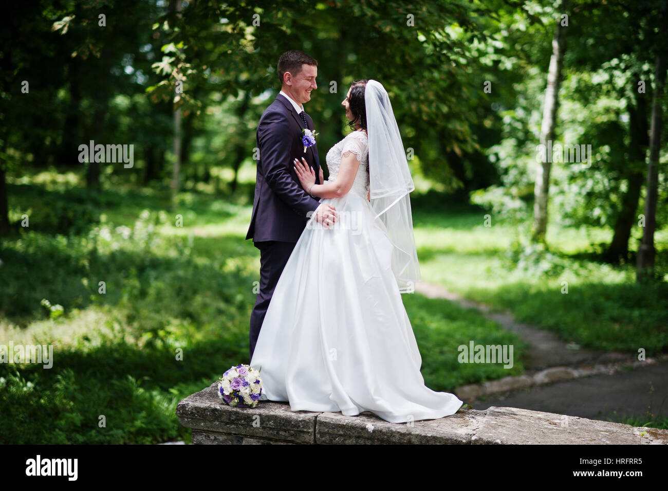 Magnificent wedding couple background green park in love Stock Photo ...