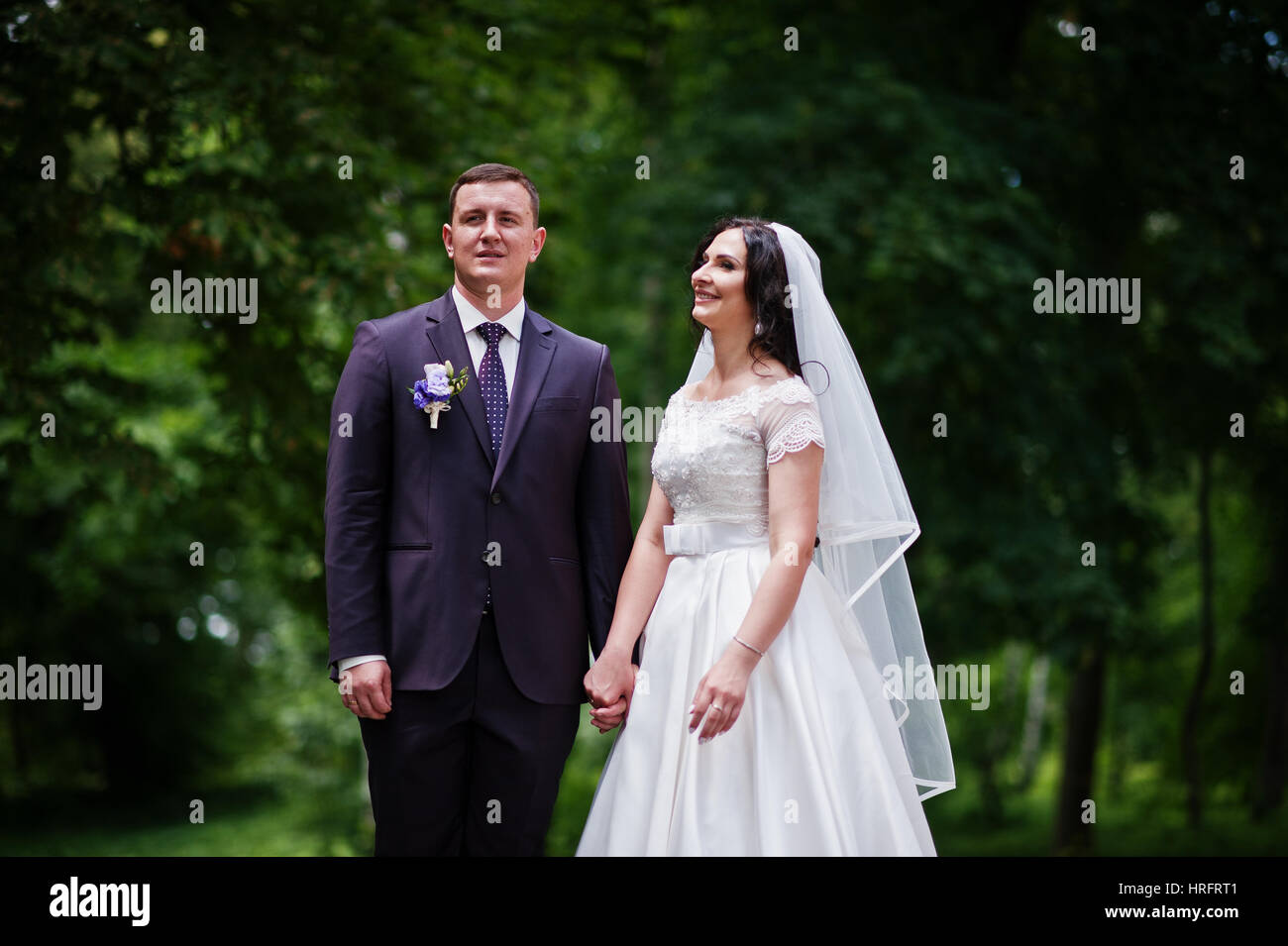 Magnificent wedding couple background green park in love Stock Photo ...