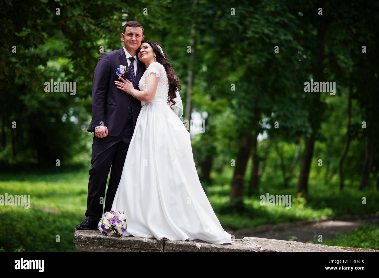 Magnificent wedding couple background green park in love Stock Photo ...