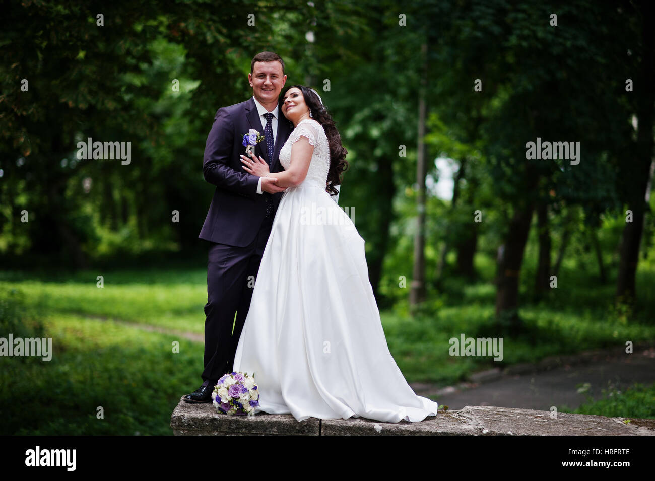 Magnificent wedding couple background green park in love Stock Photo ...