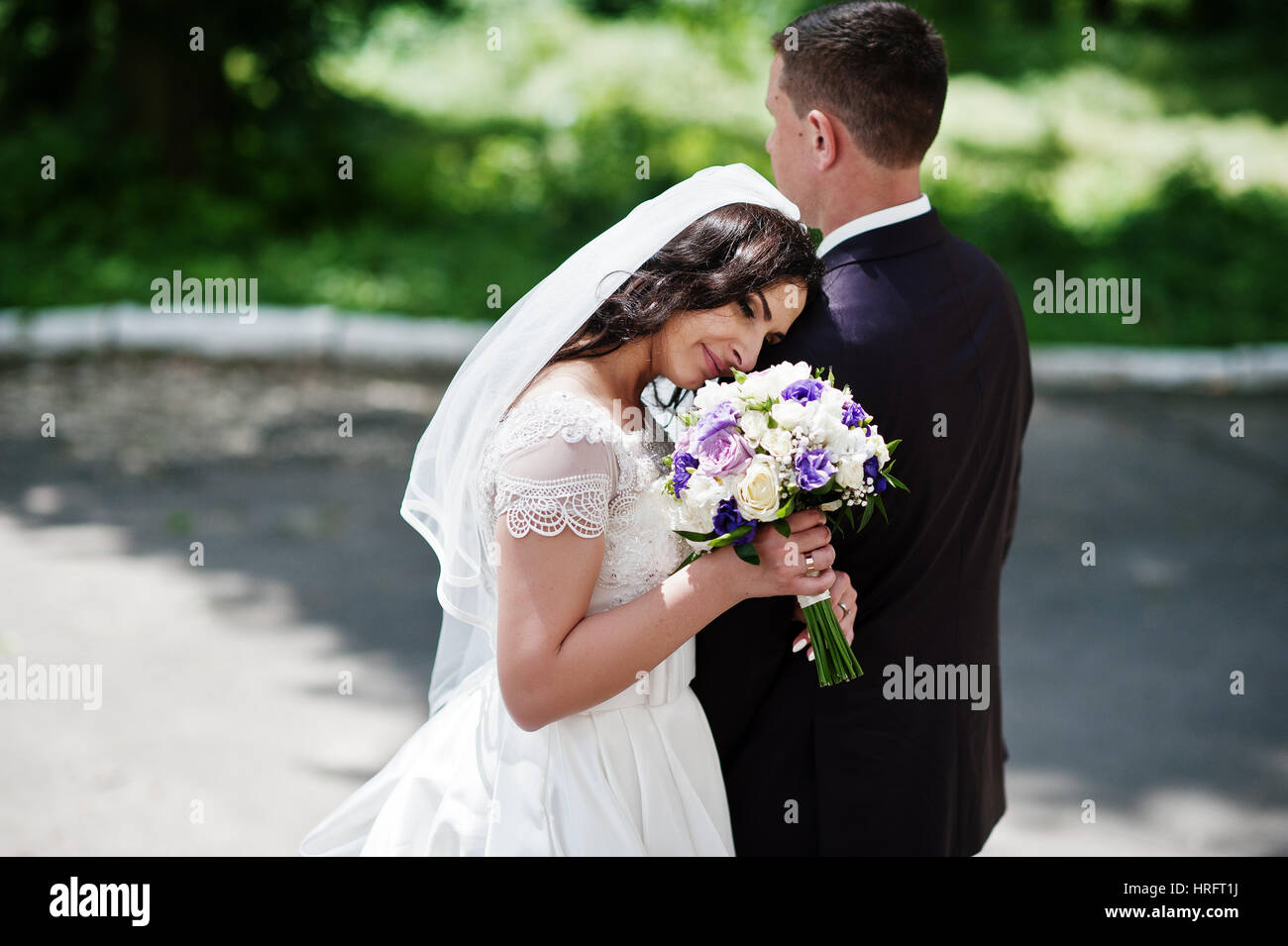Magnificent wedding couple background green park in love Stock Photo ...