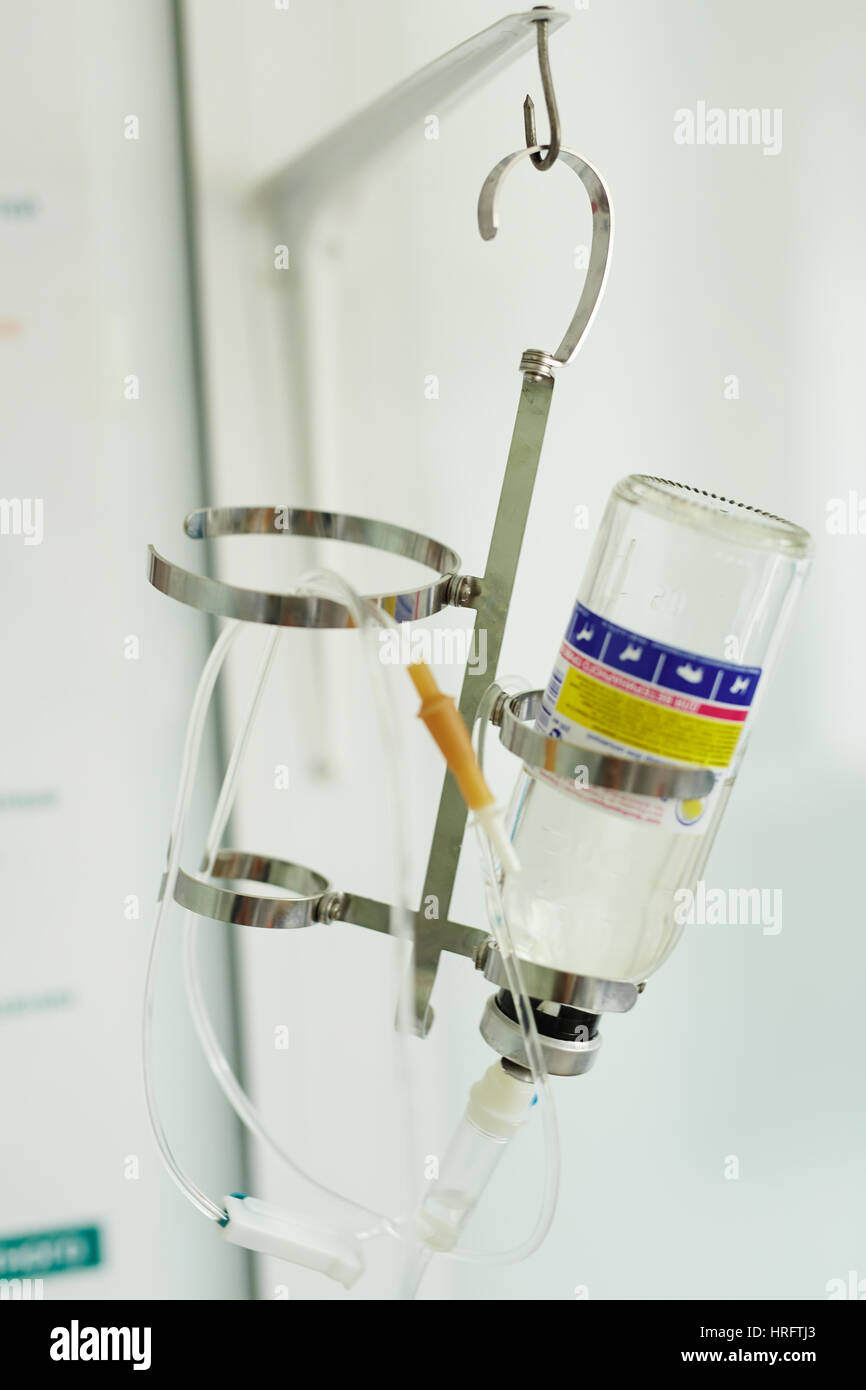 Close-up view of infusion set and bottle with intravenous injection ...
