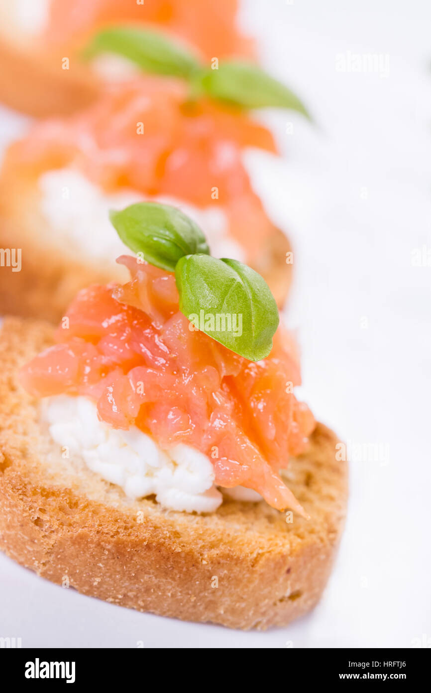 Canapes with smoked salmon, cream cheese and basil Stock Photo - Alamy