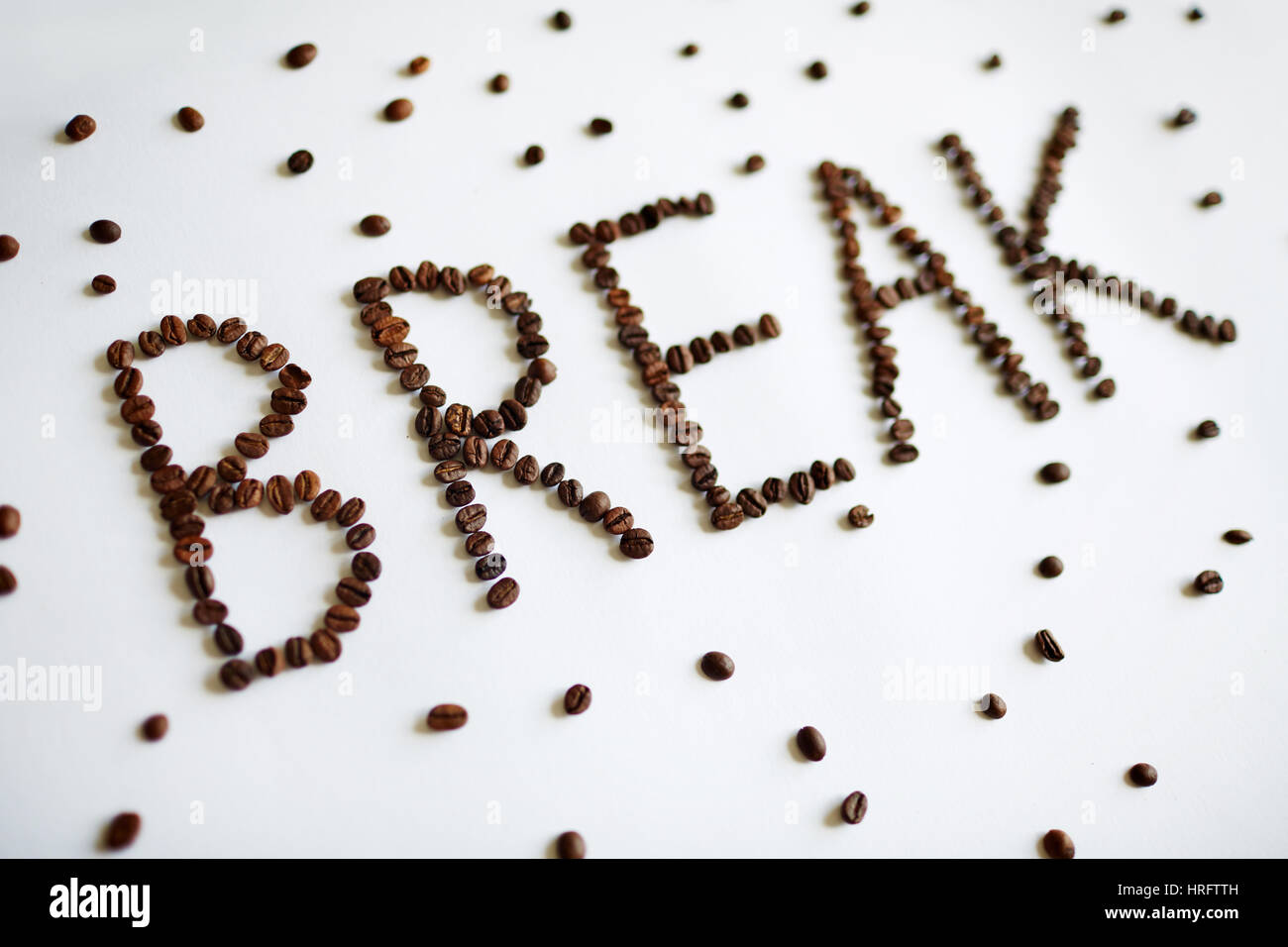 Creative coffee break concept: Word Break laid out on white table with ...
