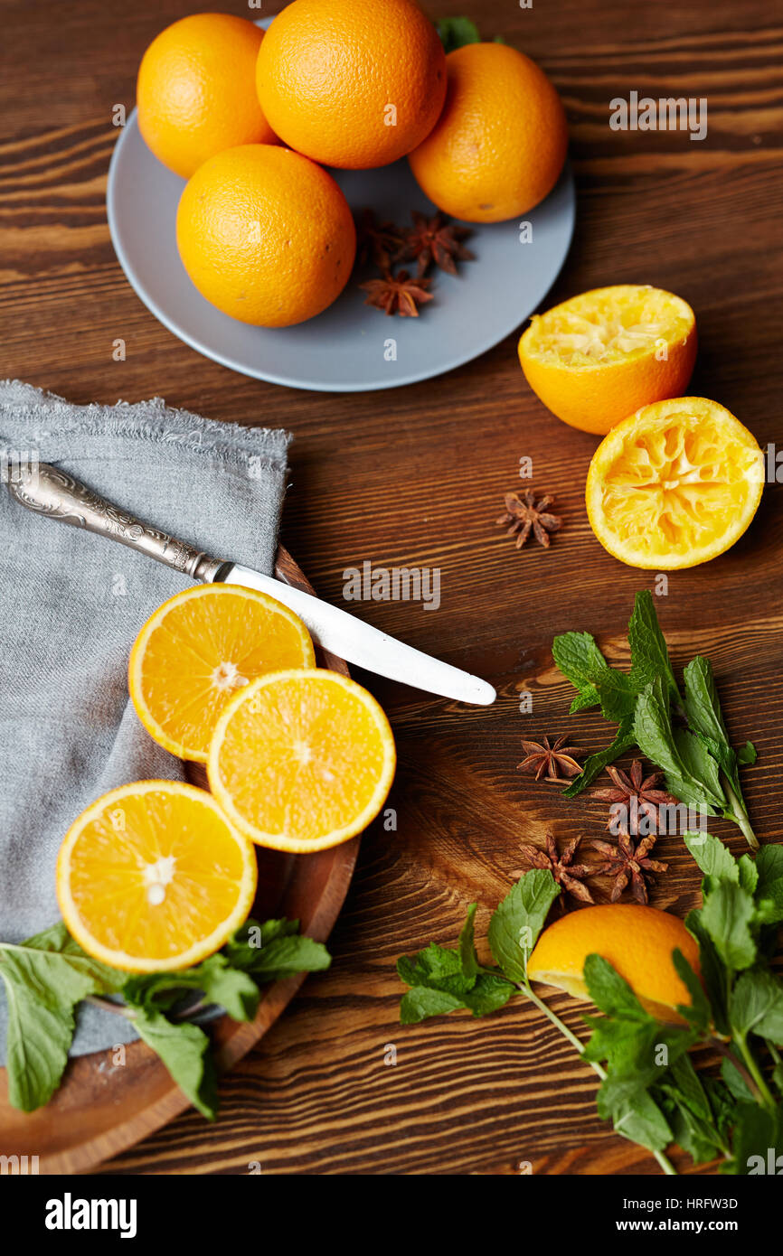 Directly above view of rustic wooden kitchen table with fruits and ...