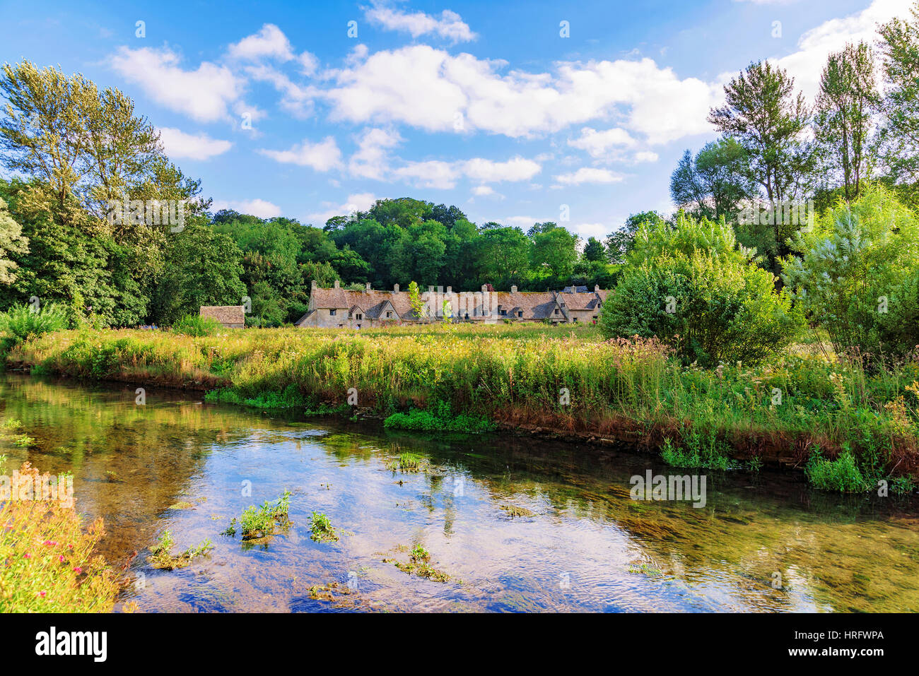 Stream in with houses in the background in the countryside Stock Photo ...