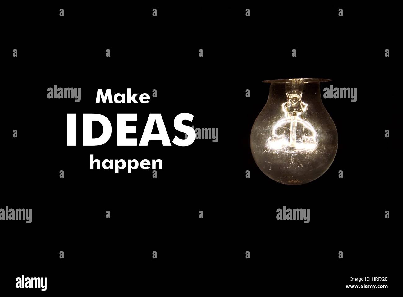 Bulb isolated on black background with inspirational message Stock ...