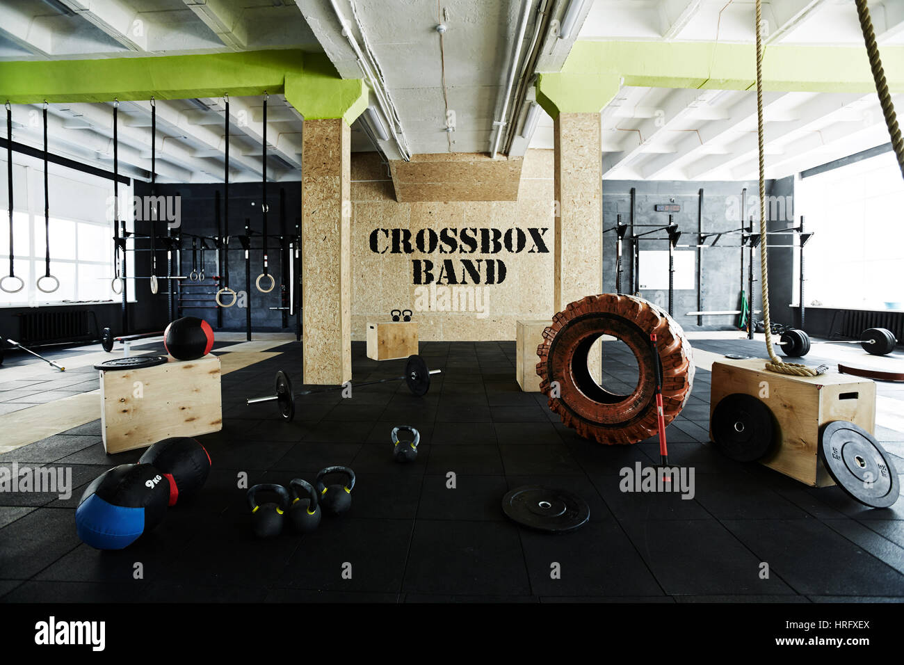 Wide angle shot of crossfit gym with modern equipment: wall mounted ...