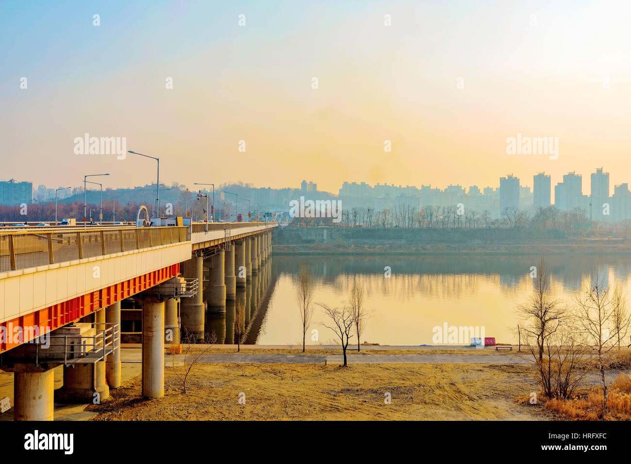 Bridge in Seoul with river park during sunset Stock Photo - Alamy