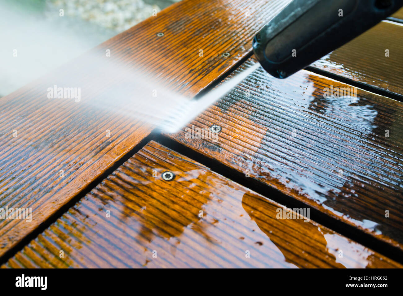 cleaning terrace with a power washer - high water pressure cleaner on ...